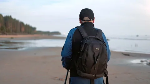 Elderly 70s man backpacker in cap Scandi... | Stock Video | Pond5