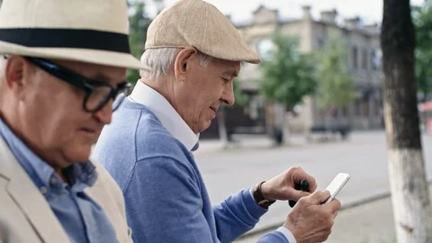 Elderly Addicted to Smartphones | Stock Video | Pond5