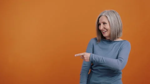 Elderly lady points finger and shows thu... | Stock Video | Pond5