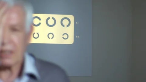 Elderly Man Reading Eye Chart | Stock Video | Pond5