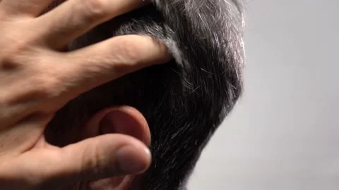 An Elderly man runs his hand through his... | Stock Video | Pond5