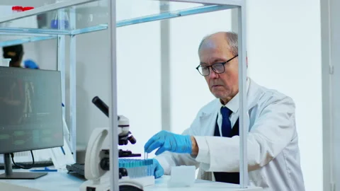 Elderly man scientist doing research ana... | Stock Video | Pond5