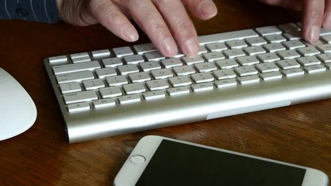 Elderly Man Is Typing On A Keyboard Whil... | Stock Video | Pond5