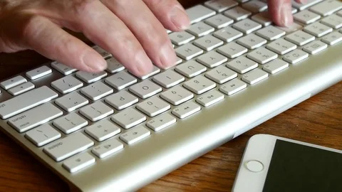 Elderly Man Is Typing On A Keyboard Whil... | Stock Video | Pond5