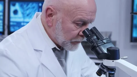 Elderly professor is doing a science exp... | Stock Video | Pond5