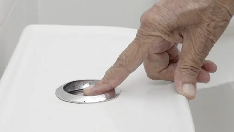 Elderly woman hand flushing toilet | Stock Video | Pond5
