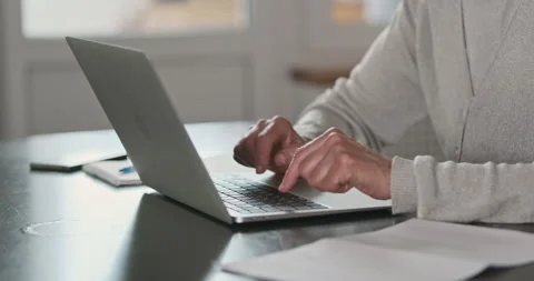 Elderly woman is slowly typing on the la... | Stock Video | Pond5