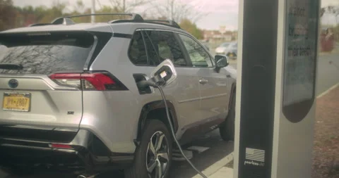 Electric Car Being Charged by EV Chargin... | Stock Video | Pond5