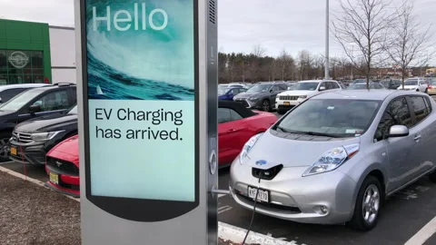 Electric Car Being Charged by EV Chargin... | Stock Video | Pond5