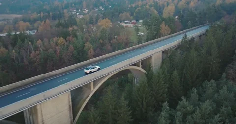 Electric Car on Elevated Bridge, Trackin... | Stock Video | Pond5