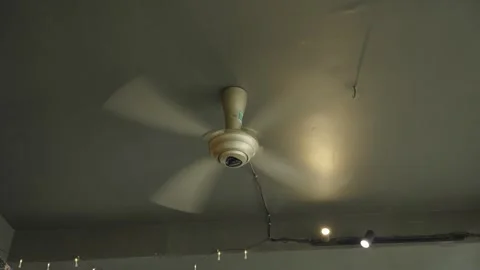 Electric ceiling fan spinning fast. Asia... | Stock Video | Pond5