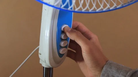 Electric fan with hand close-up | Stock Video | Pond5