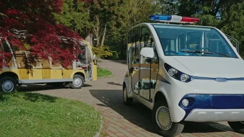 Electric police car near city park, secu... | Stock Video | Pond5