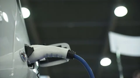 Electric vehicle charging port plugging ... | Stock Video | Pond5