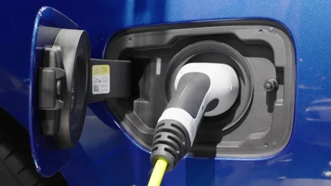 Electric vehicle charging port plugging ... | Stock Video | Pond5