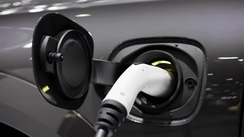 Electric vehicle charging port plugging ... | Stock Video | Pond5