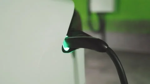 Electric vehicle charging port plugging ... | Stock Video | Pond5