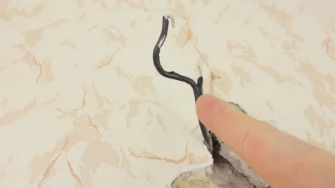 Electric wire sticking out of the wall. ... | Stock Video | Pond5