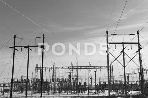 Electrical grid infrastructure, high voltage substation, pylons and ...