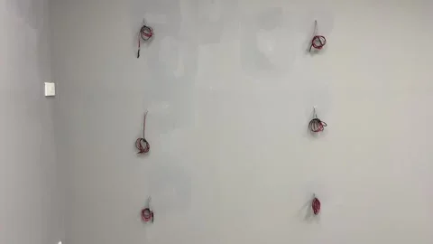 Electrical wire cable hanging from grey ... | Stock Video | Pond5