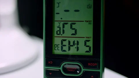 Electronic clock shows time and temperat... | Stock Video | Pond5
