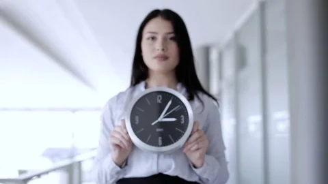 Elegant Woman Show Clock To Say That Wor... | Stock Video | Pond5