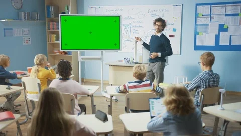 In Elementary School Classroom Teacher U... | Stock Video | Pond5