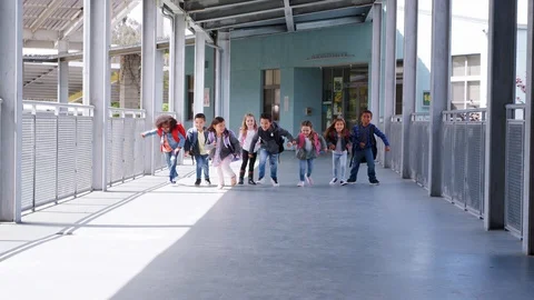 Elementary school kids race to camera in... | Stock Video | Pond5