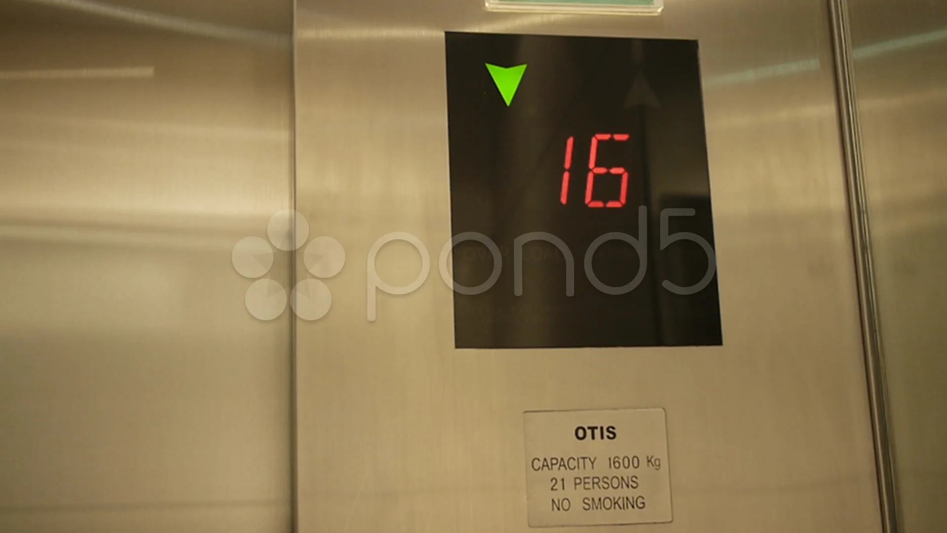 Elevator Going Down Man Stands In Modern Elevator With Iron Doors.