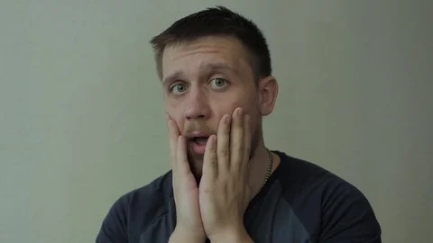 Embarrassed man looking at the camera. | Stock Video | Pond5