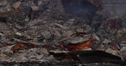 Embers burning underneath a layer of ash... | Stock Video | Pond5