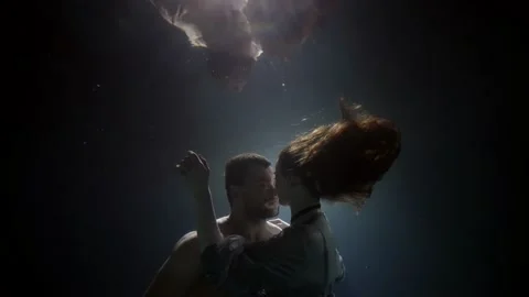 embrace underwater, loving pair is huggi... | Stock Video | Pond5