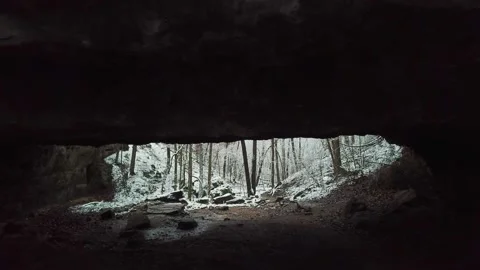 emerging from a cave into winter scene | Stock Video | Pond5