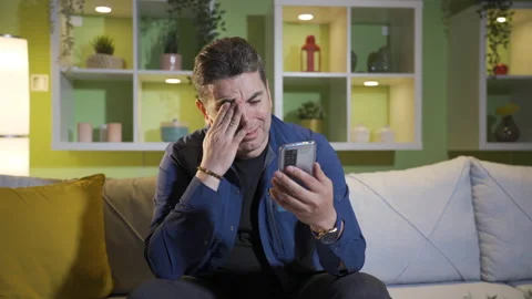 Emotional and depressed man crying at ho... | Stock Video | Pond5