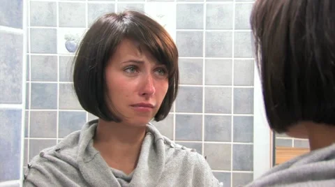 emotional girl crying in a bathroom | Stock Video | Pond5