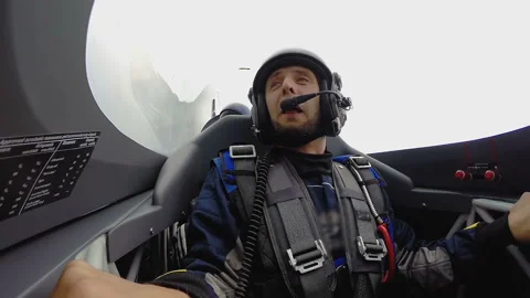 Emotional man sitting in jet cockpit mak... | Stock Video | Pond5