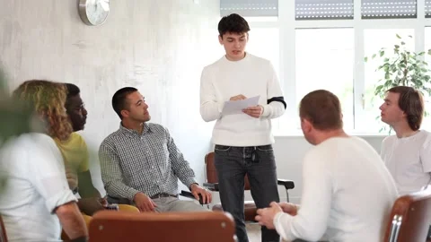 Emotional young guy talking to male coll... | Stock Video | Pond5