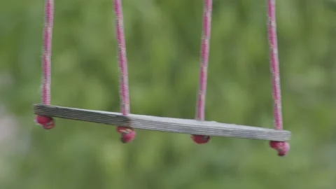 An empty abandoned hanging rope swing mo... | Stock Video | Pond5
