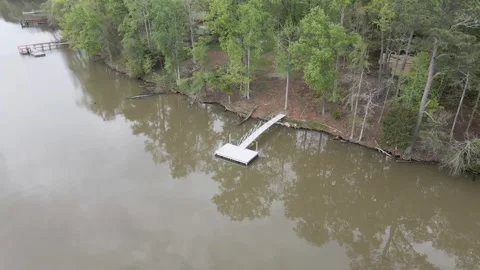 Empty boat dock on the lake. Zoom out sh... | Stock Video | Pond5