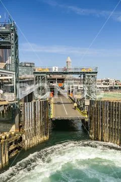 Empty loading ramp as a ferry approaches the dock Stock Photo #106955925