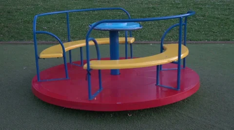 Empty Merry Go Round spinning on the pla... | Stock Video | Pond5