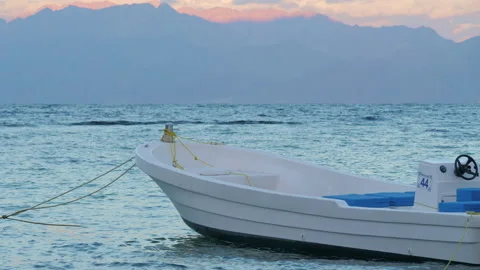 Empty motor boat is rocking on Red sea w... | Stock Video | Pond5