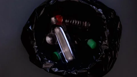 Empty plastic bottles fall into the tras... | Stock Video | Pond5