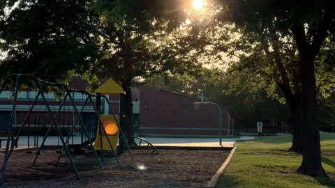 Empty playground at gold sunset, | Stock Video | Pond5