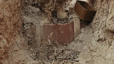 Empty shell casings in a soldier's trenc... | Stock Video | Pond5