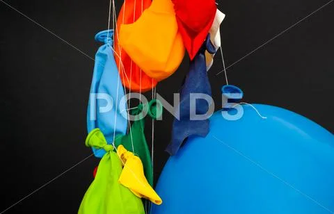 Photograph: End of the party. Some burst, deflated and one inflated ...