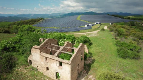 Energy transition - ruins to solar farm | Stock Video | Pond5