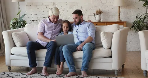 Engaged gen Z boy, grandpa and dad using... | Stock Video | Pond5