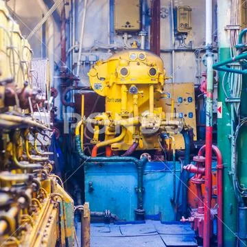 Photograph: Engine Room on a cargo boat ship interior, ship's engine ...