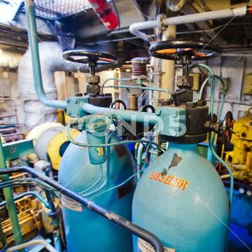 Engine Room on a cargo boat ship interior, ship's engine heavy ...
